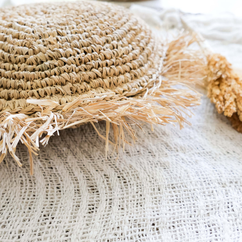 Handmade round raffia pillow cover with fringe | Joglo Living